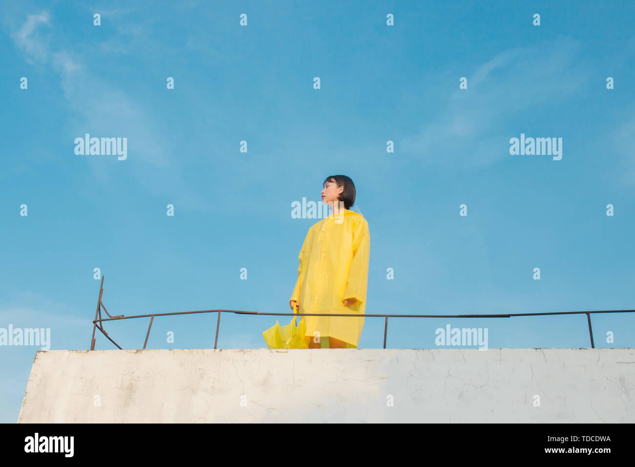 Sunny day raincoat Stock Photo - Alamy