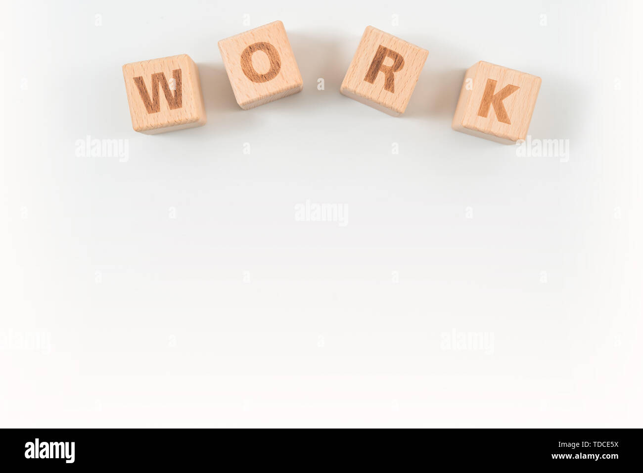 Work wooden blocks of business concept isolated on white background ...