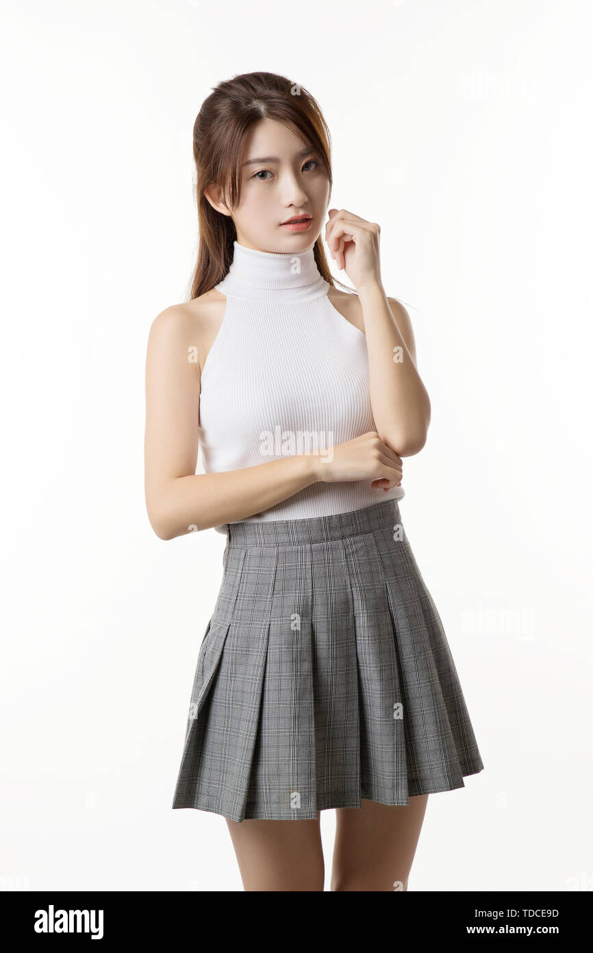 Beautiful cute college student against white background Stock Photo - Alamy