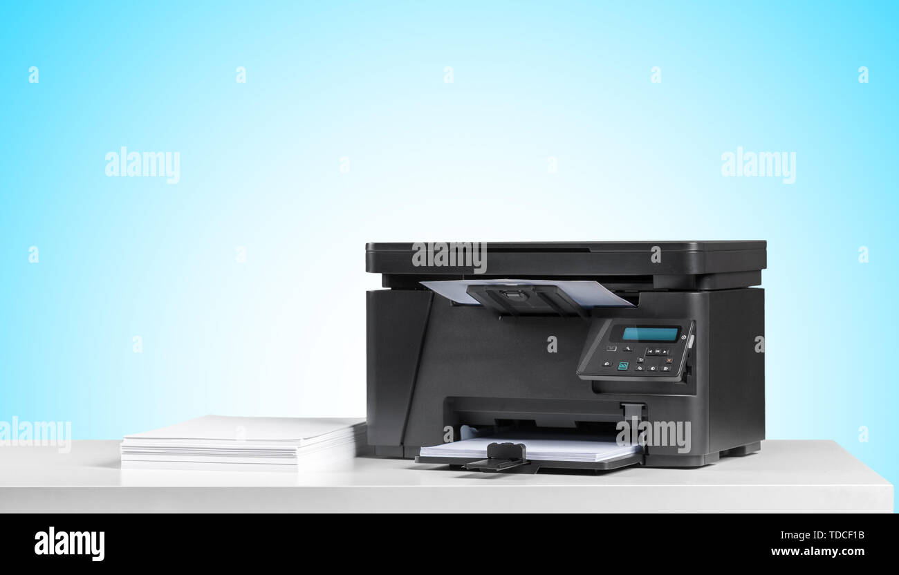 Printer copier machine on a bright colored background Stock Photo - Alamy
