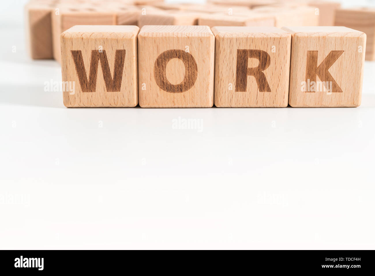 Work wooden blocks of business concept isolated on white background ...