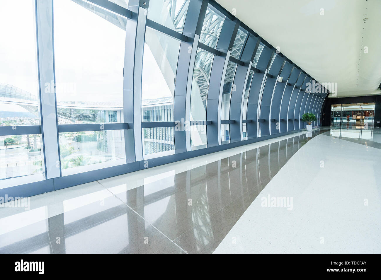 corridor with many glass windows in modern shopping mall Stock Photo ...