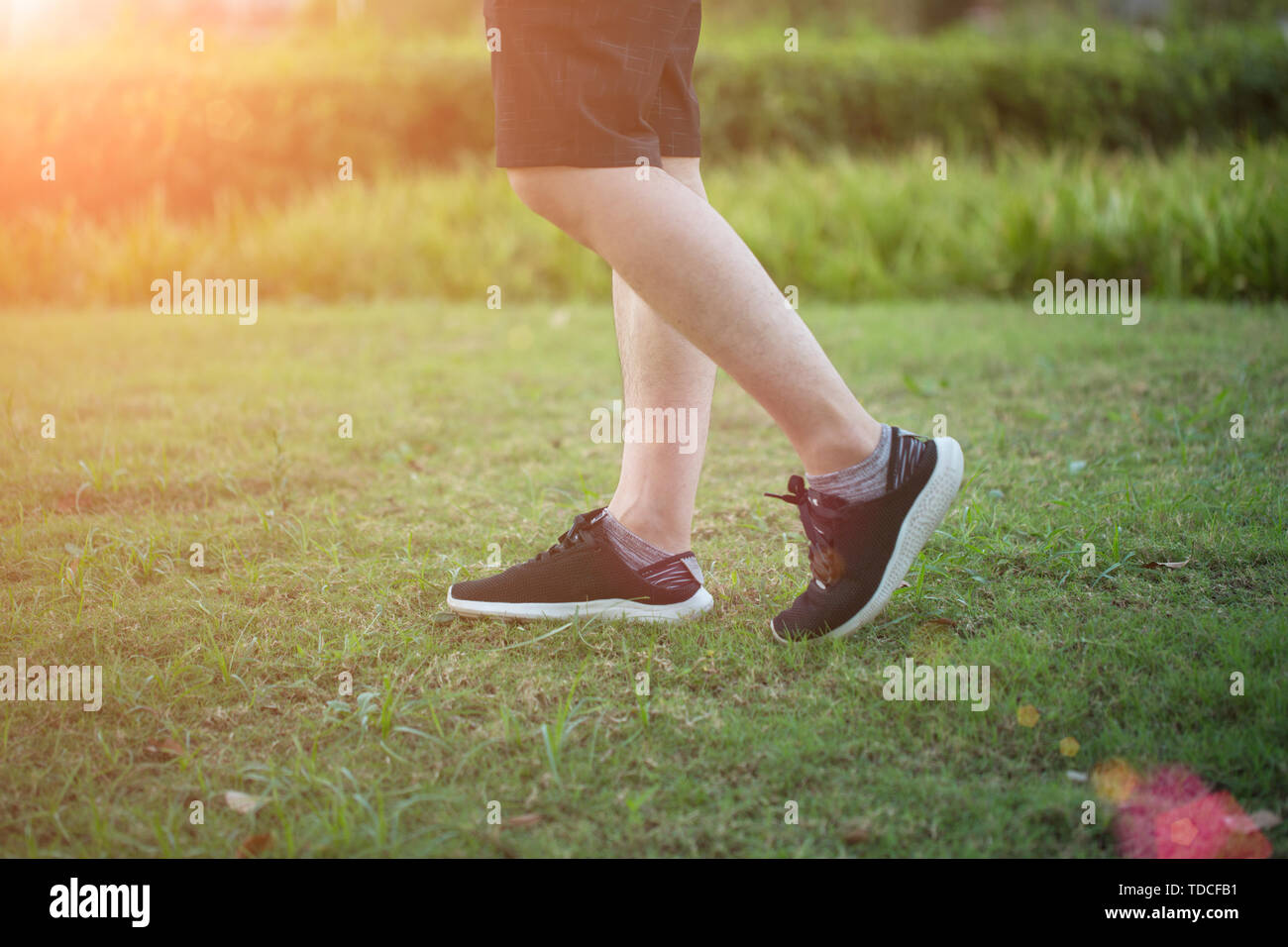 Man running on grass Stock Photo - Alamy