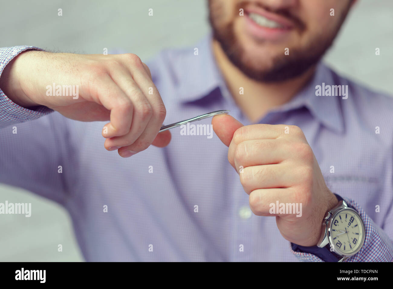 young man polishing his nails Stock Photo - Alamy