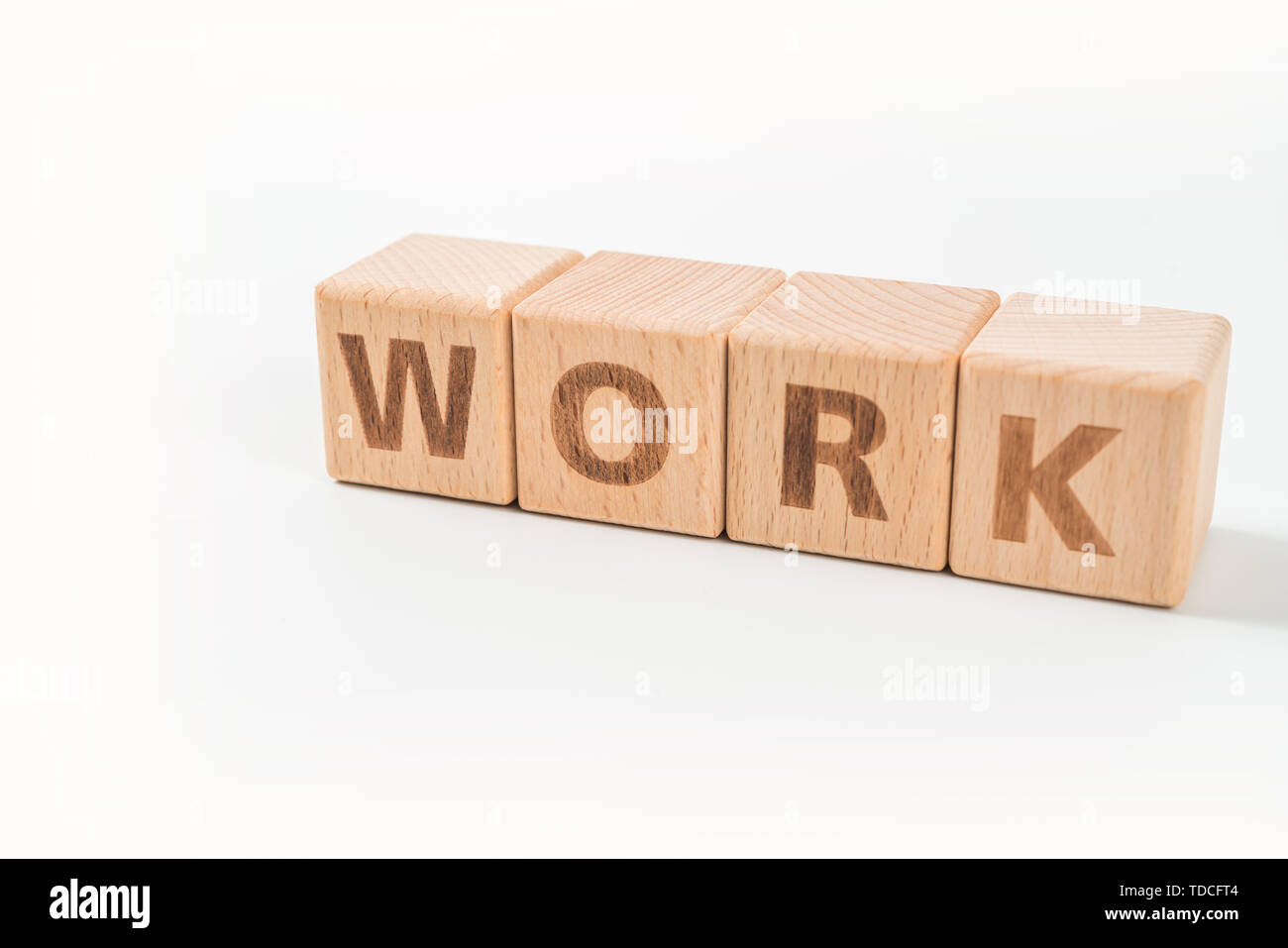 Work wooden blocks of business concept isolated on white background ...