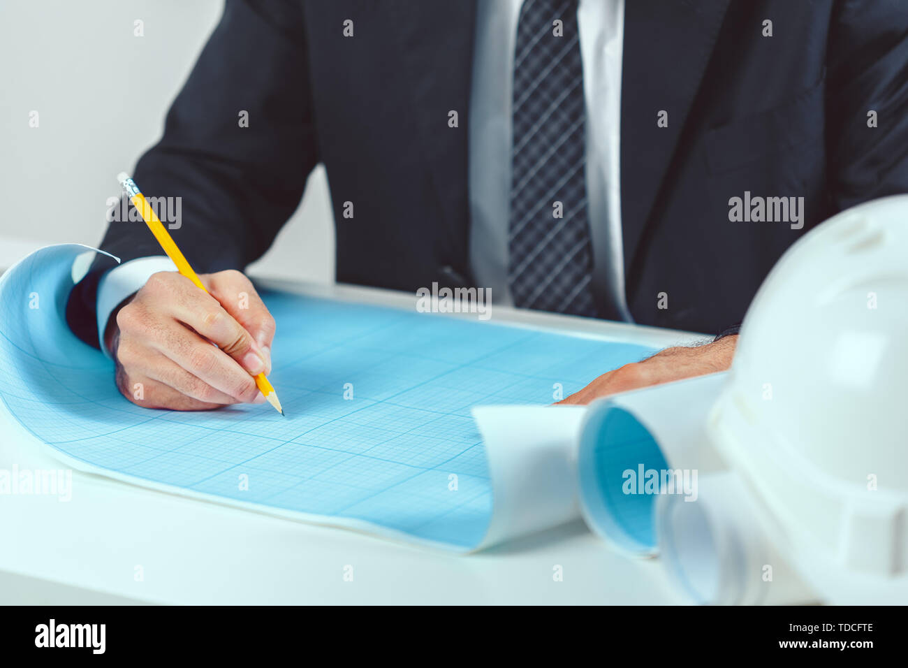 architect sitting at desk and working Stock Photo - Alamy