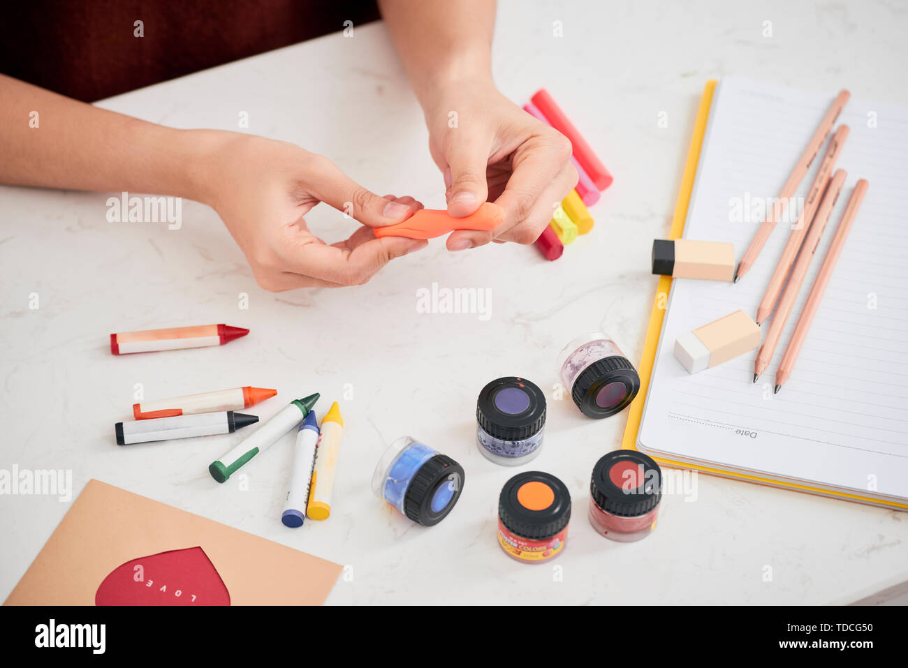 Female hands working with polymer clay. The process of working with the ...