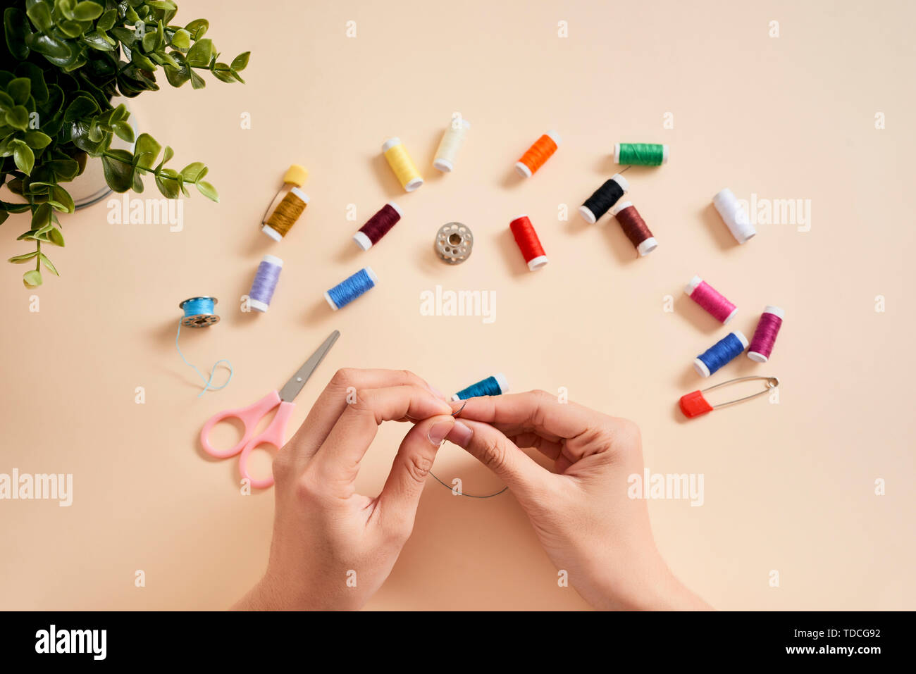 people, needlework, sewing and tailoring concept - tailor woman with ...