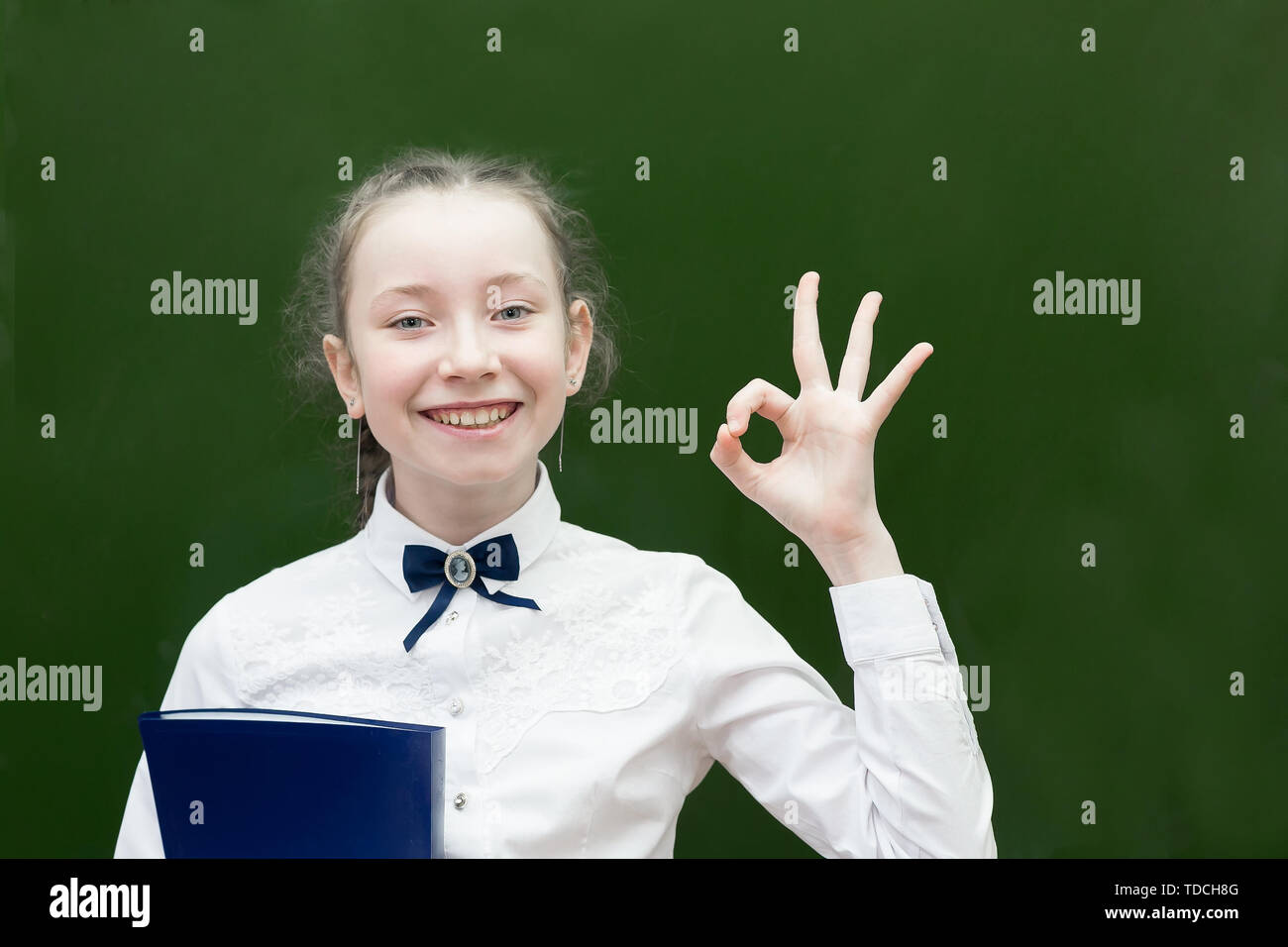 Girl student shows a hand sign that she is fine Passed the exam for a ...