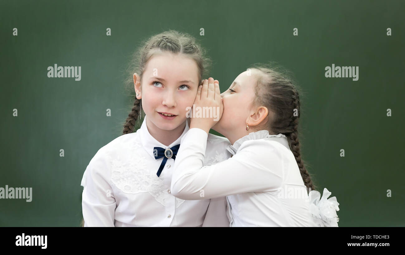 Schoolgirls classmates share their secrets of secrets telling a whisper ...