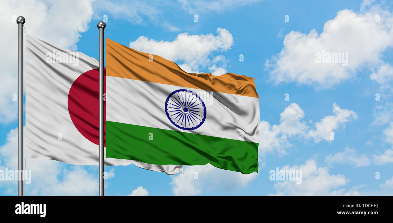 Japan and India flag waving in the wind against white cloudy blue sky ...