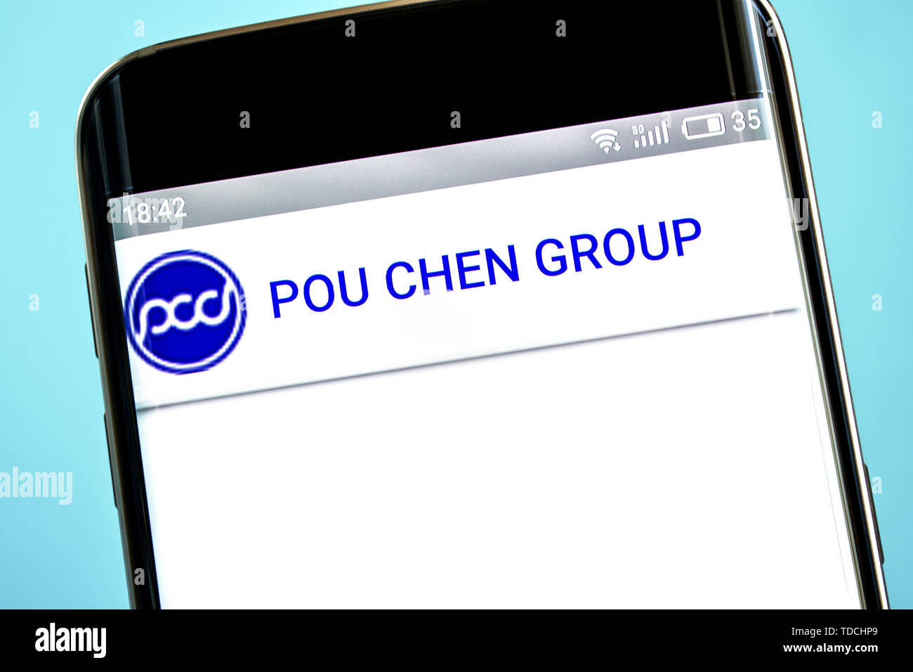Berdyansk, Ukraine - 6 June 2019: Pou Chen website homepage. Pou Chen logo visible on the phone ...