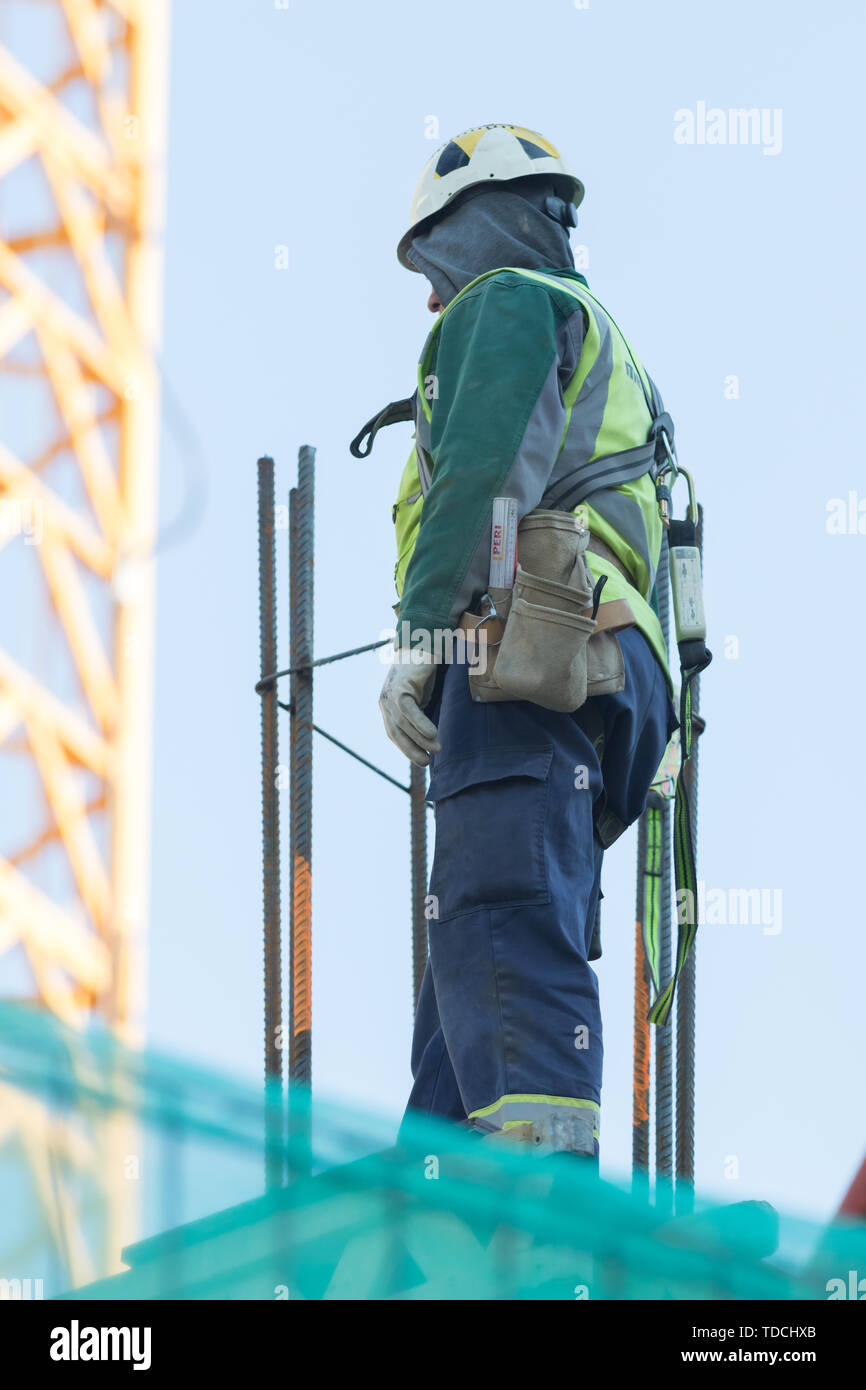 Engineer were walking up the stairs to survey the construction site ...