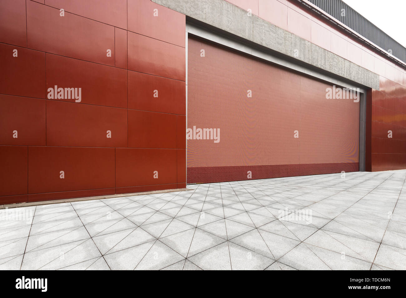 Modern building with red tile wall Stock Photo - Alamy