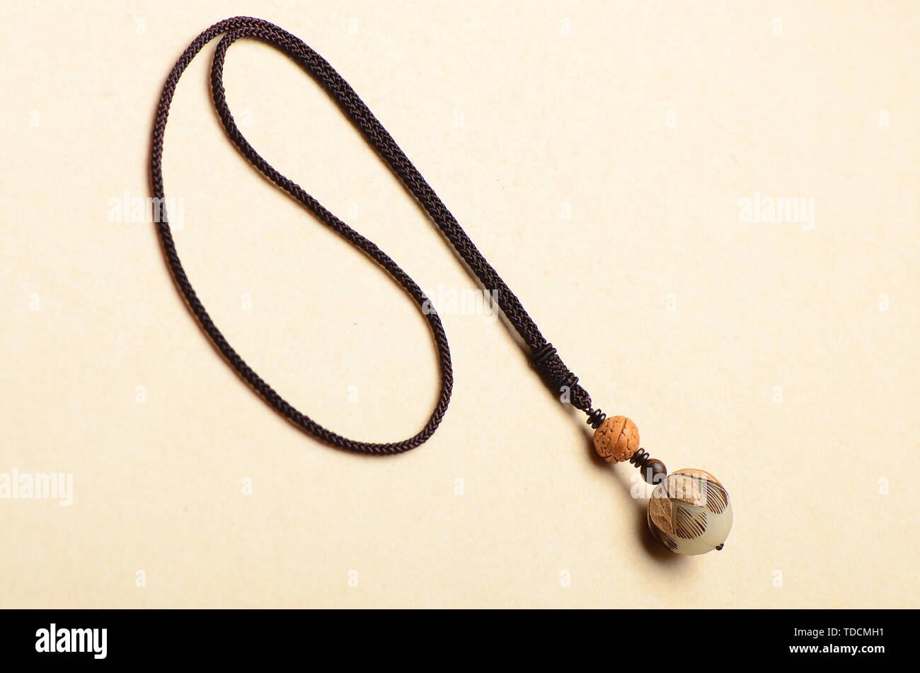 Bodhi pendant, necklace, wool chain Stock Photo - Alamy