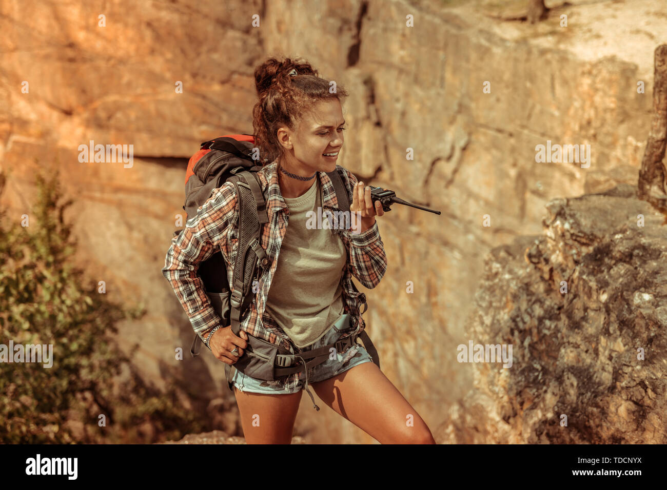 Pretty attractive woman holding a portable radio set Stock Photo - Alamy
