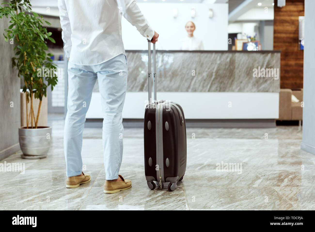 man at hotel reception Stock Photo - Alamy