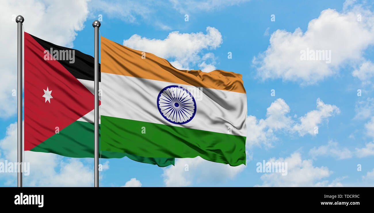 Jordan and India flag waving in the wind against white cloudy blue sky ...