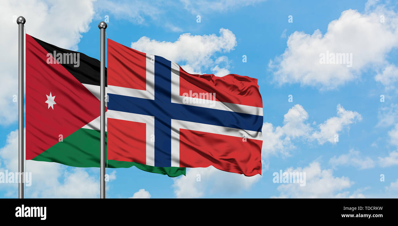 Jordan and Norway flag waving in the wind against white cloudy blue sky ...