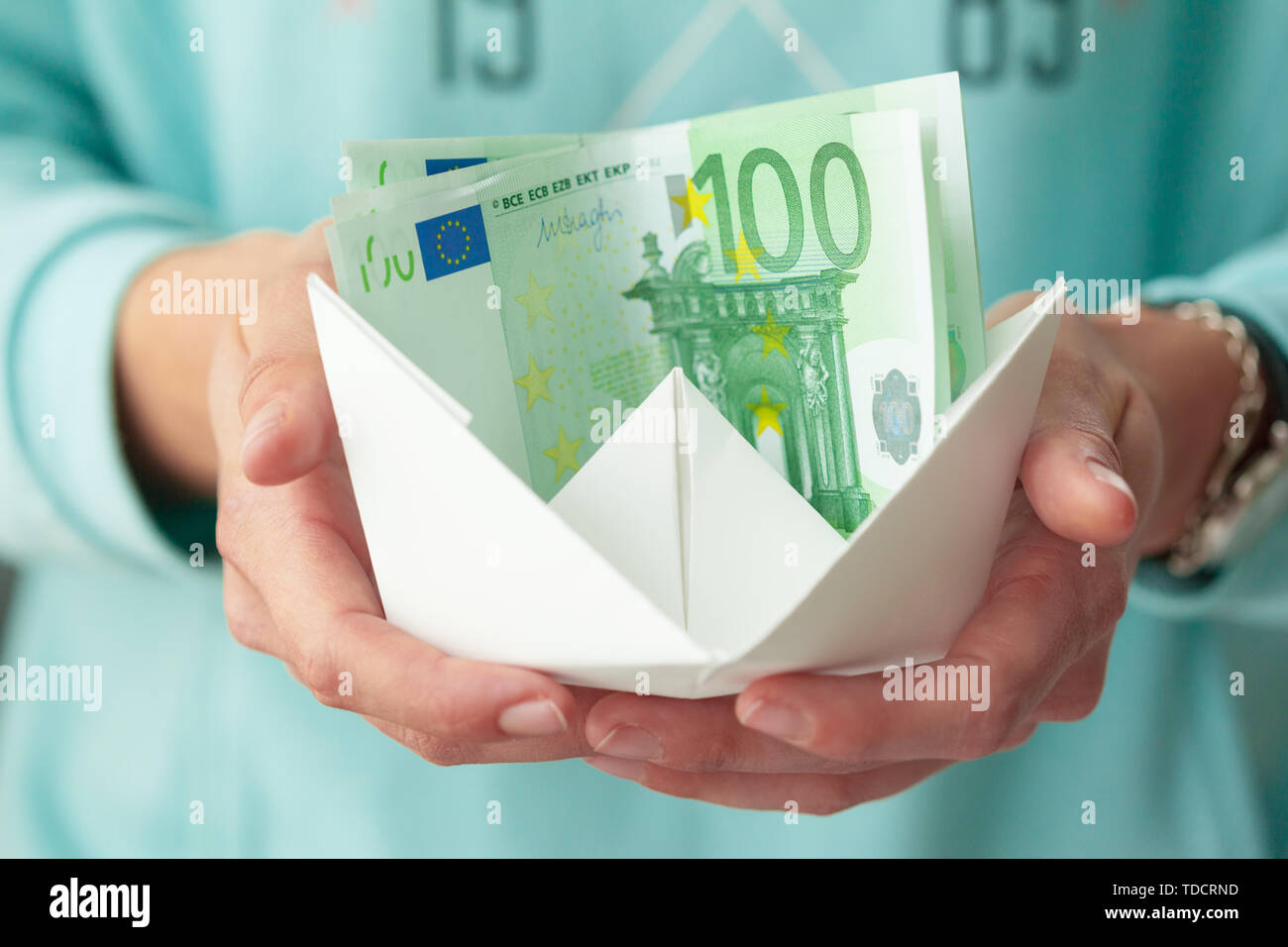 Money banknotes paper boats hi-res stock photography and images - Alamy