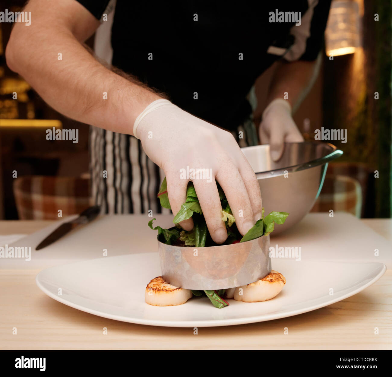 Professopnal chef is cooking appetizer with scallops Stock Photo - Alamy
