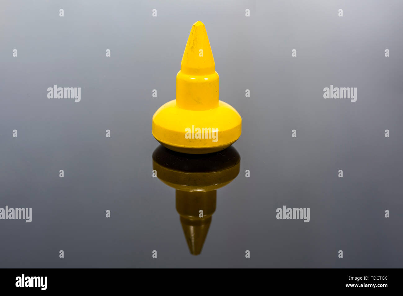 Colorful play figures on black mirror board Stock Photo - Alamy