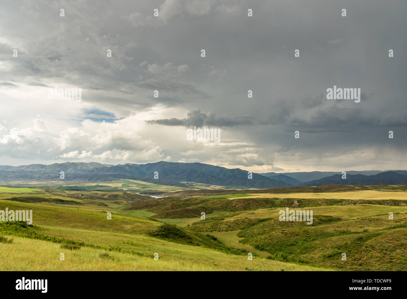 Hillside prairie villages under cloudy clouds Stock Photo - Alamy