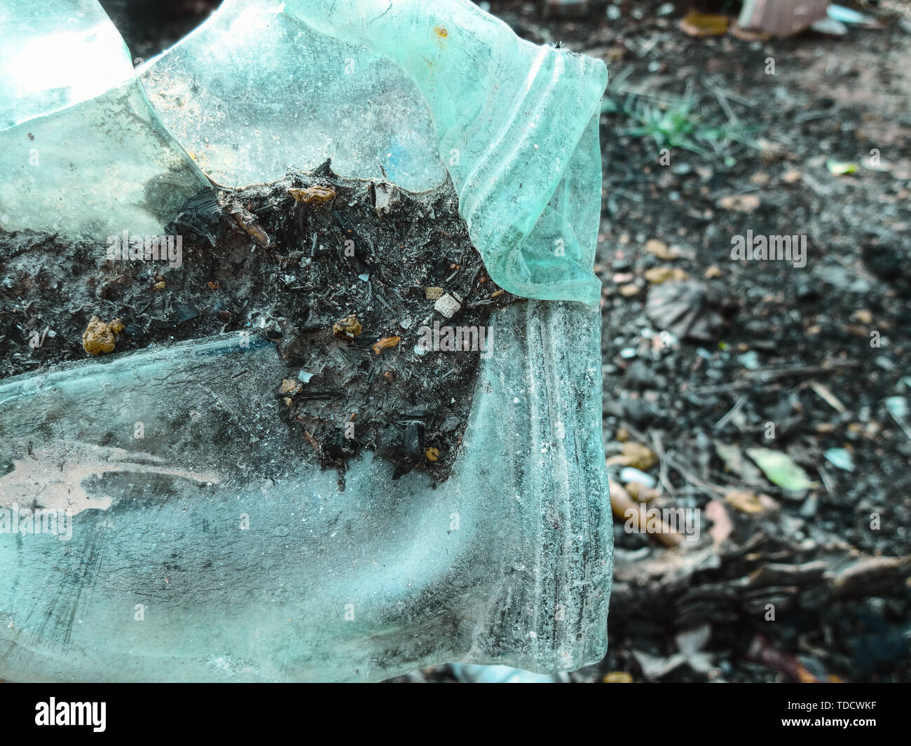 Burned, melted glass cans Stock Photo - Alamy