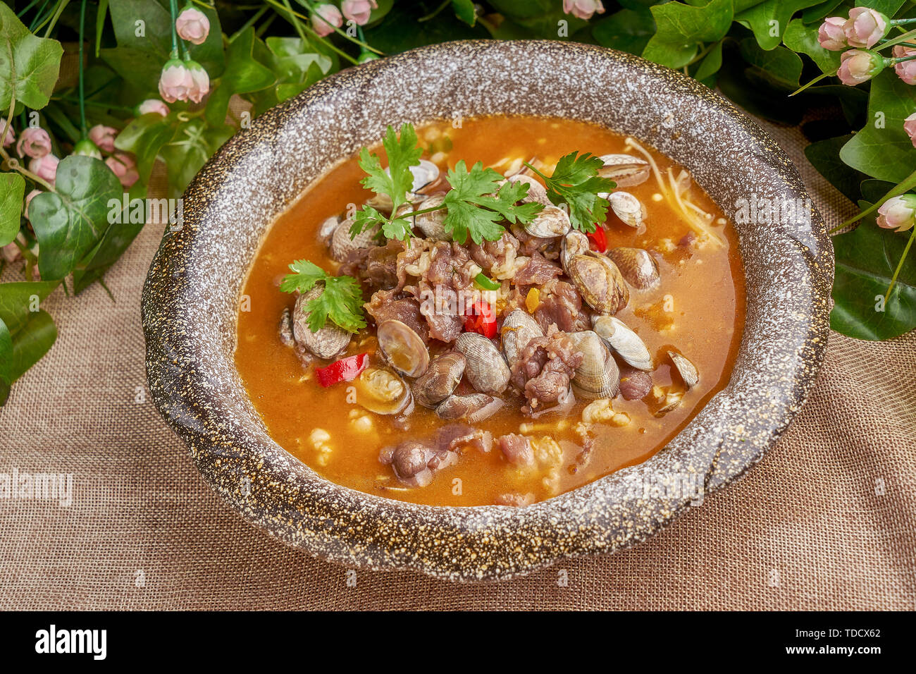 Fat cow clam golden needle mushroom chowder Stock Photo - Alamy