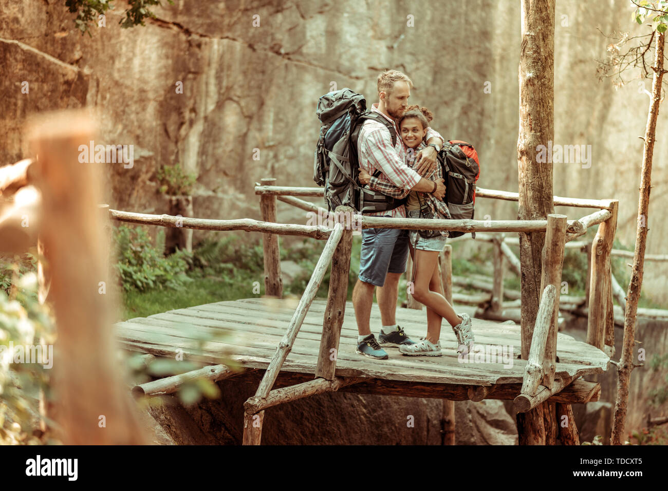 Happy romantic couple being together on the bridge Stock Photo - Alamy