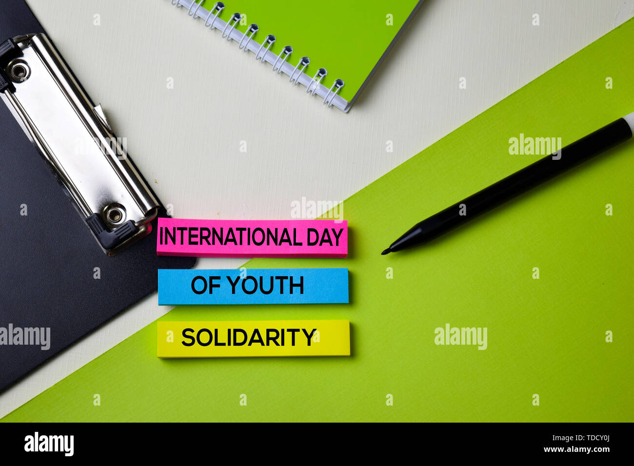 International of Youth Solidarity text on top view office desk table of ...