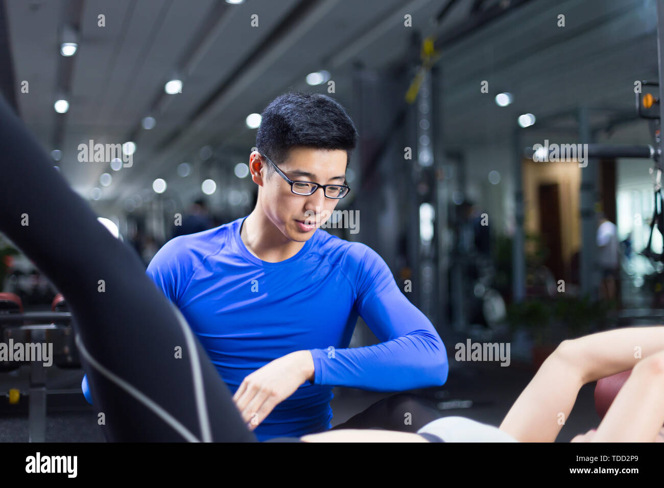 young asian people working out in modern gym Stock Photo - Alamy