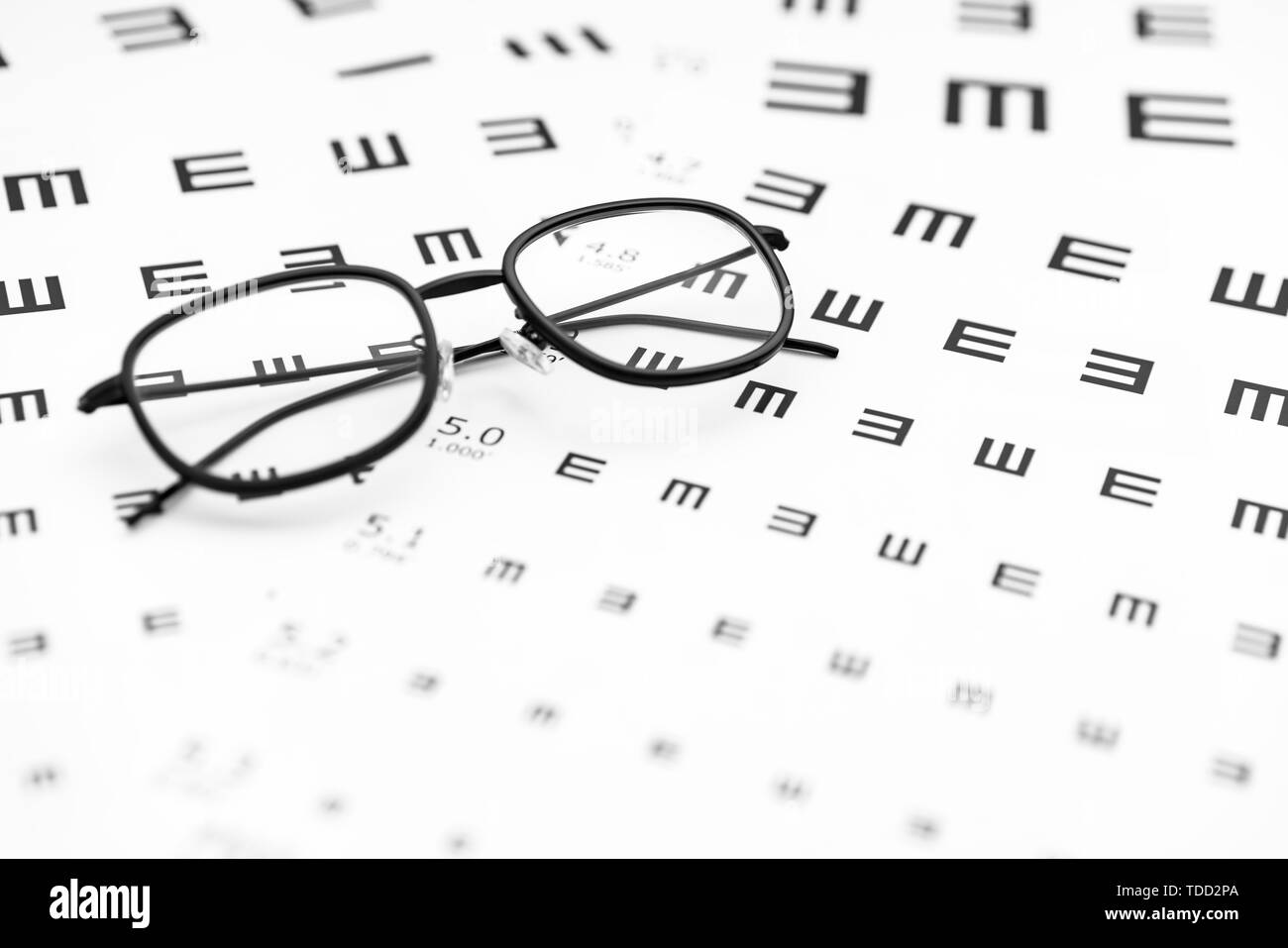 Black glasses and visual meter on white background Stock Photo - Alamy
