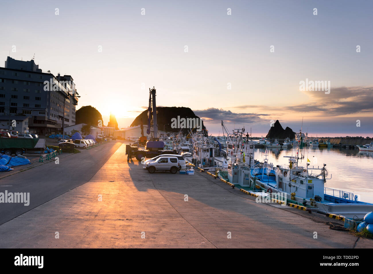 pier with crowded ships in japan hokkaido at sunrise Stock Photo - Alamy