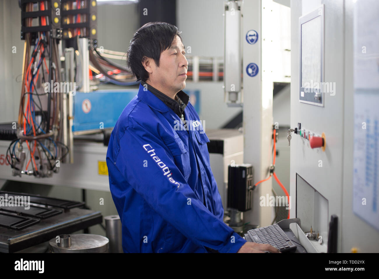 Man worker working in factory Stock Photo - Alamy
