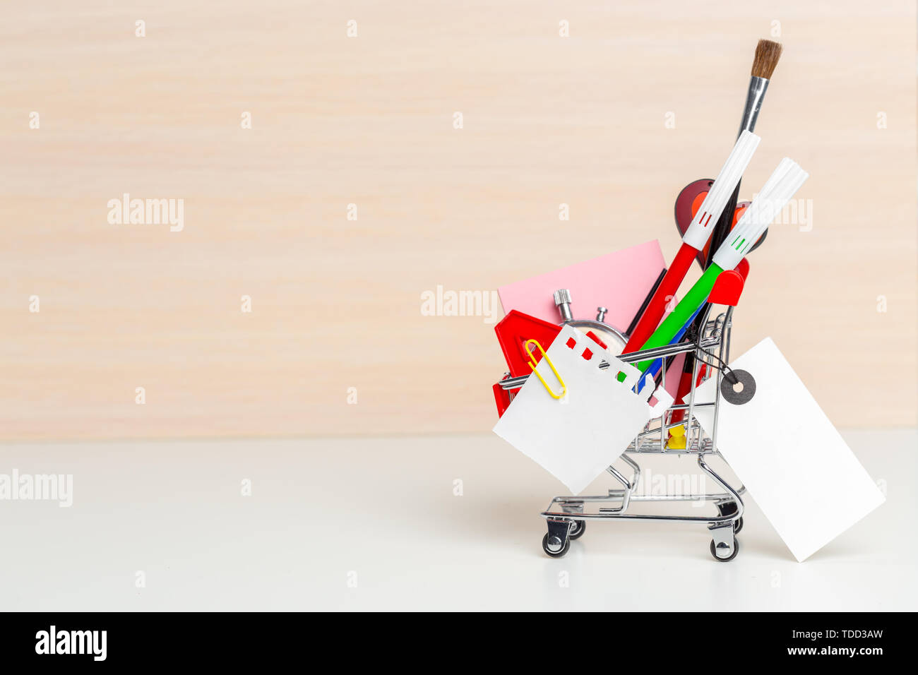 Stationery items in shopping trolley at left side Stock Photo - Alamy