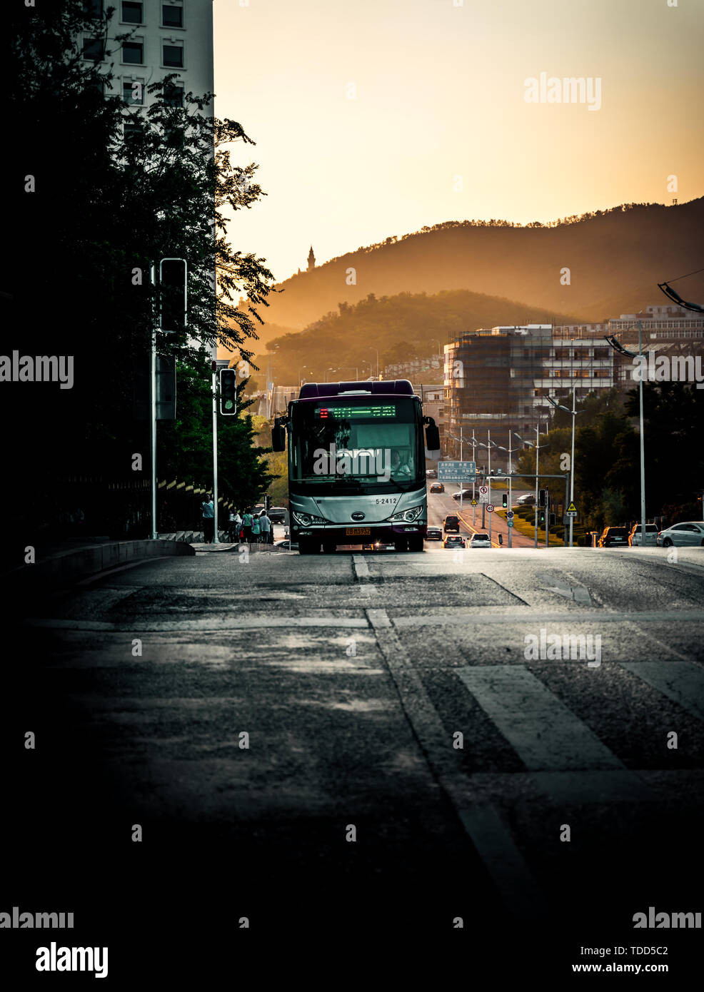 Bus in the sunset Stock Photo - Alamy