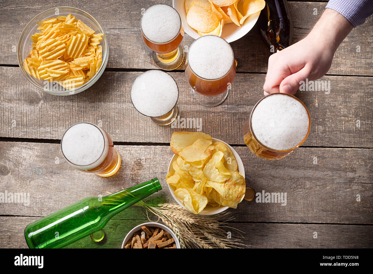 Human hands and glasses of beer Stock Photo - Alamy