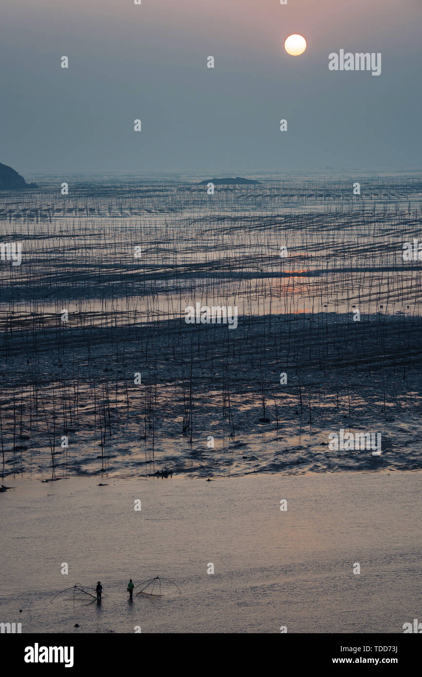 Sunrise on Xiapu beach, Fujian, ink style Stock Photo - Alamy