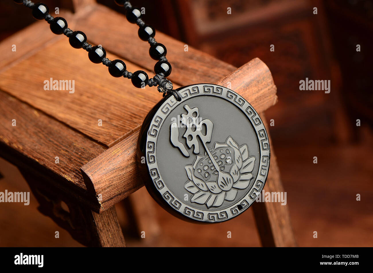 Buddha chain flower obsidian pendant Stock Photo - Alamy