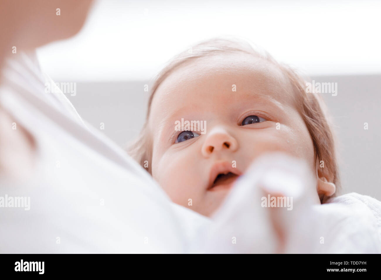 Woman rocking chair holding baby hi-res stock photography and images ...