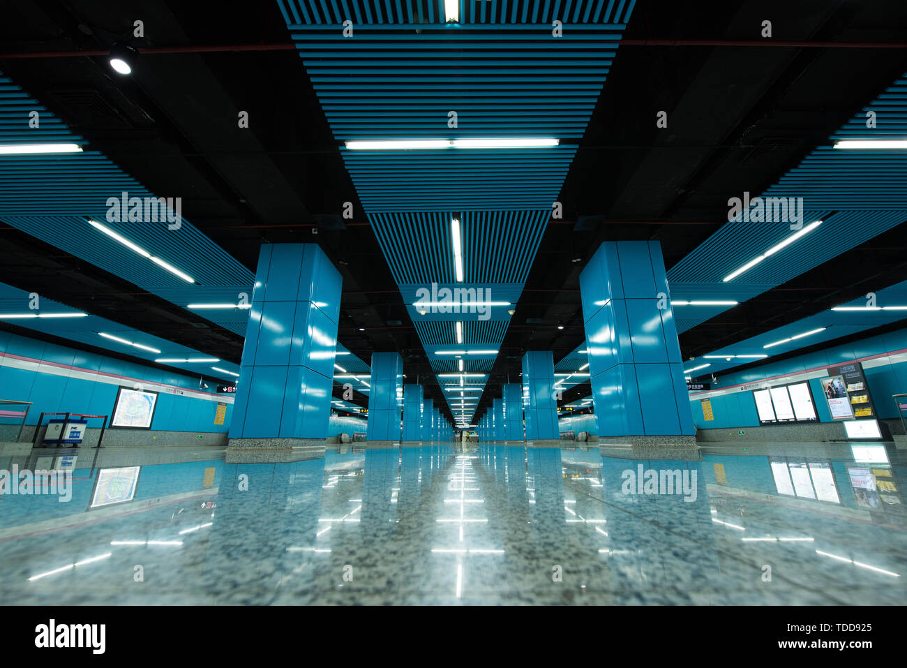 Blue, empty subway station Stock Photo - Alamy