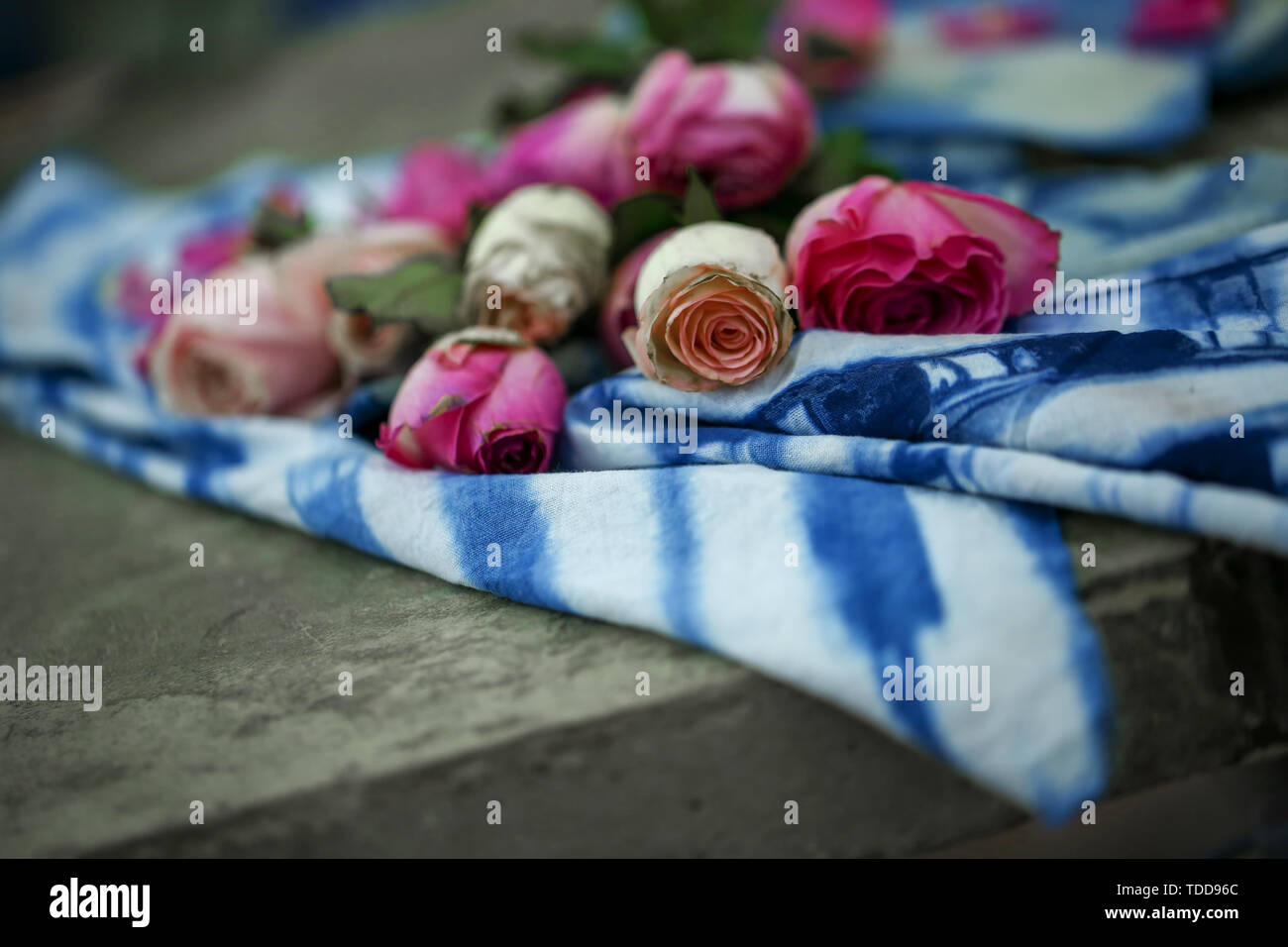 Roses on batik woven items Stock Photo - Alamy