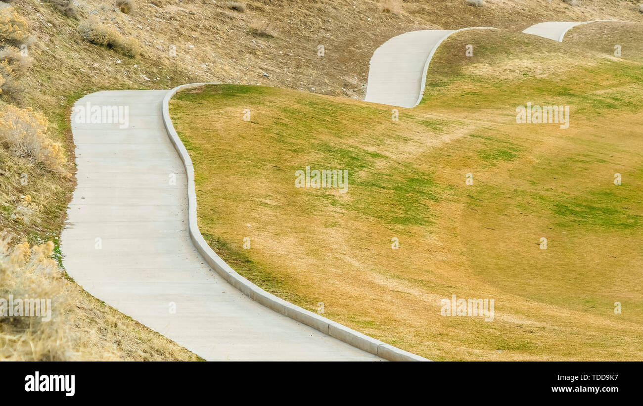 Panorama Close up of a paved pathway running through the slope of a ...