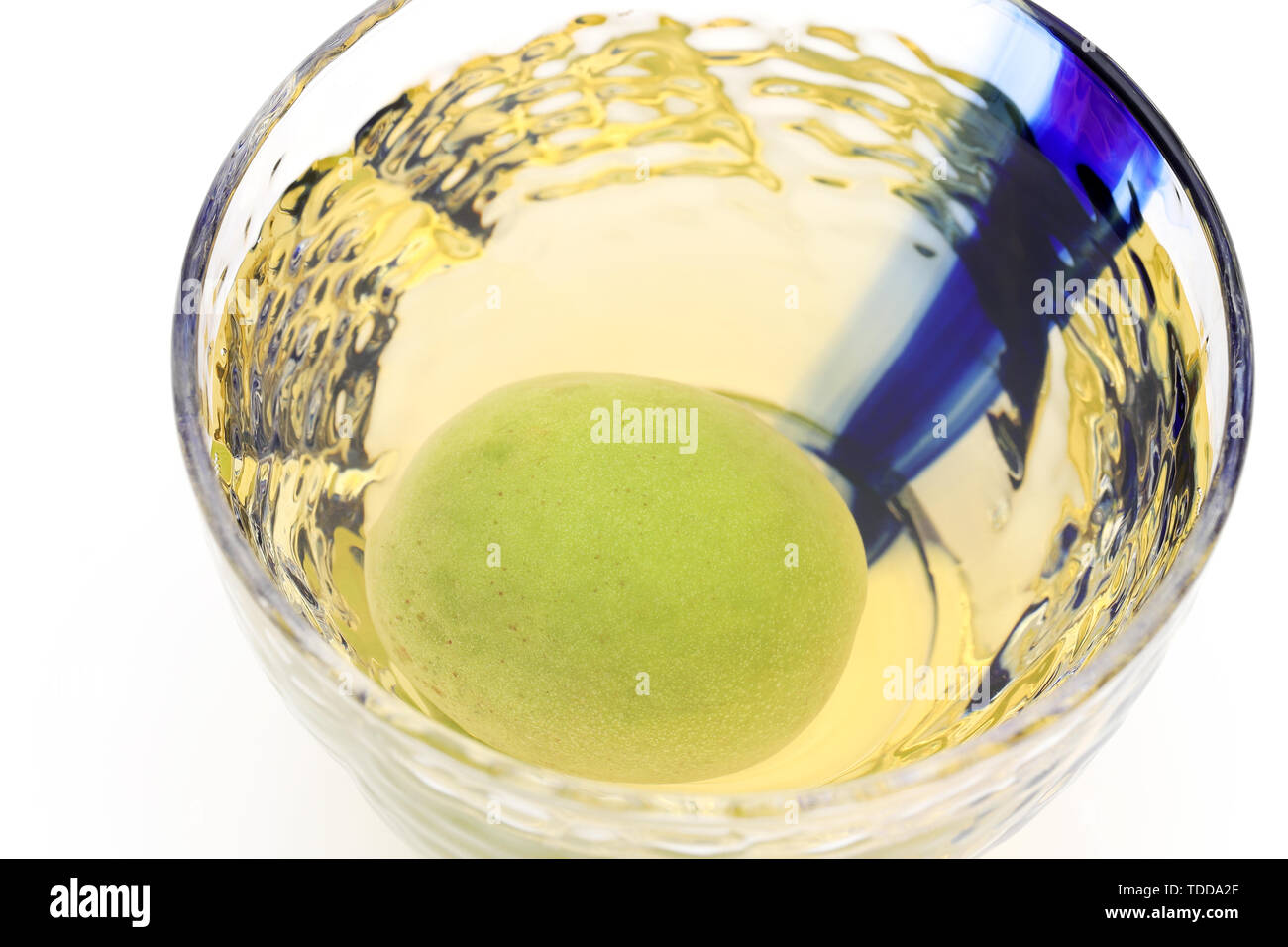 Japanese plum wine called umeshu on white background Stock Photo - Alamy