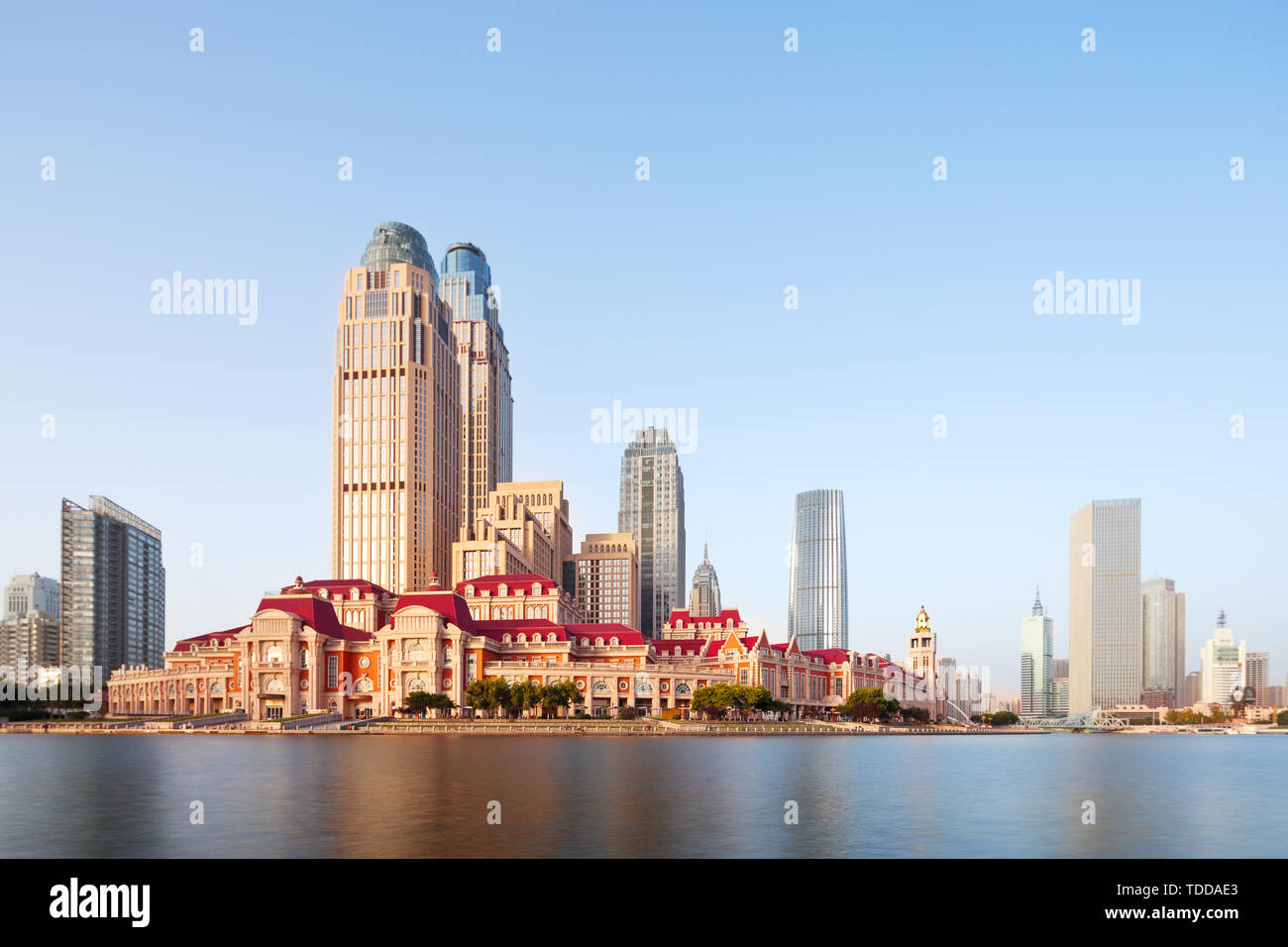 modern buildings near water in midtown of modern city Stock Photo - Alamy