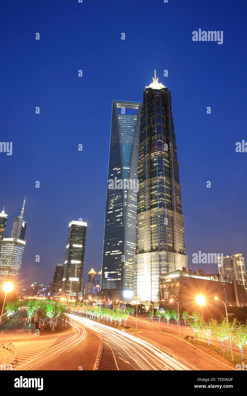 the light trails on the modern building background in shanghai c Stock ...