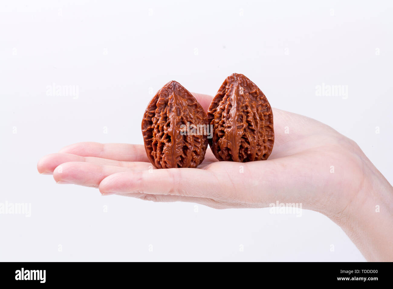Hand dish walnuts Stock Photo - Alamy