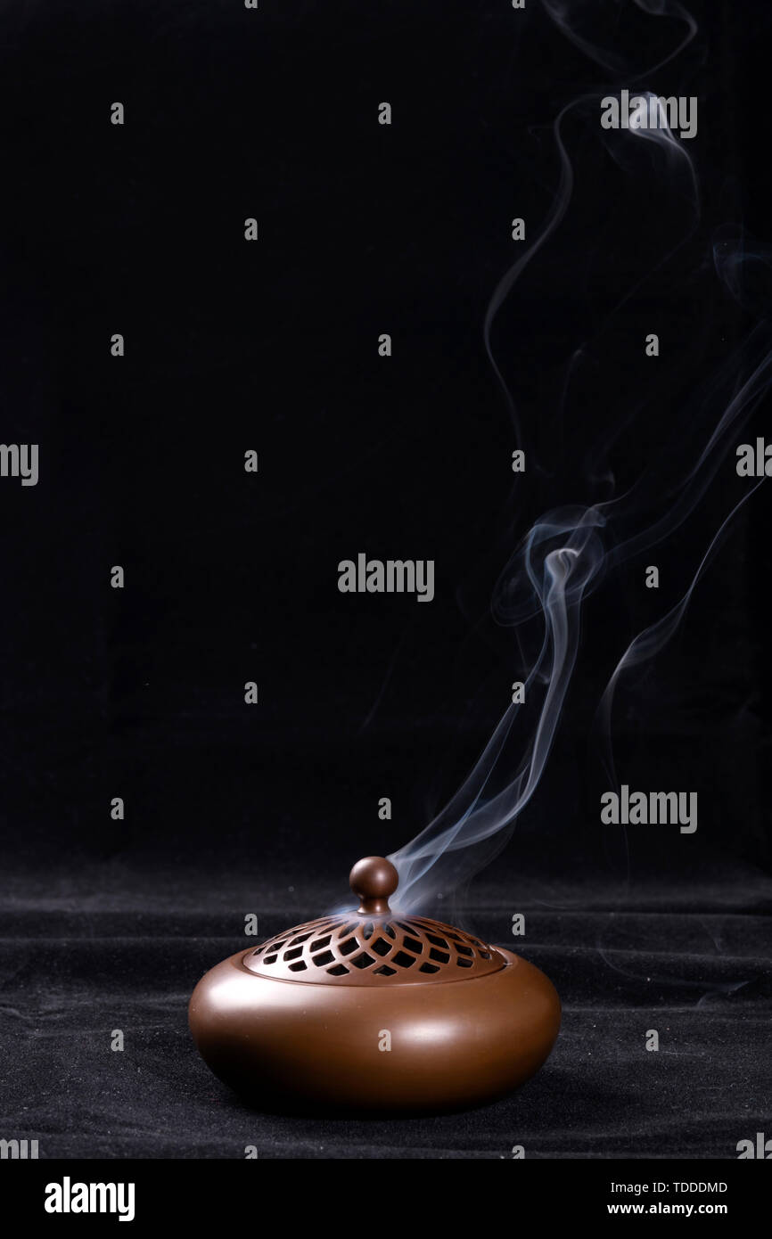 Copper incense stove Stock Photo - Alamy