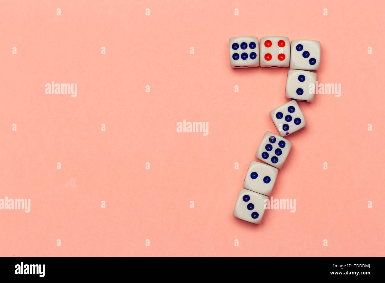 Number seven lay out of dice on peachy background close up Stock Photo ...